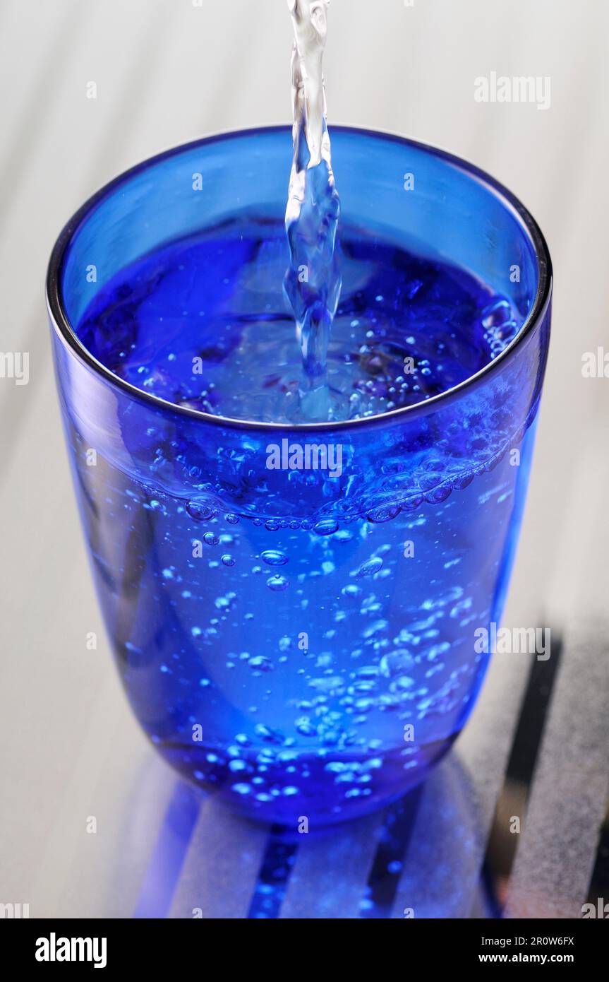 Pouring a glass of water Stock Photo - Alamy