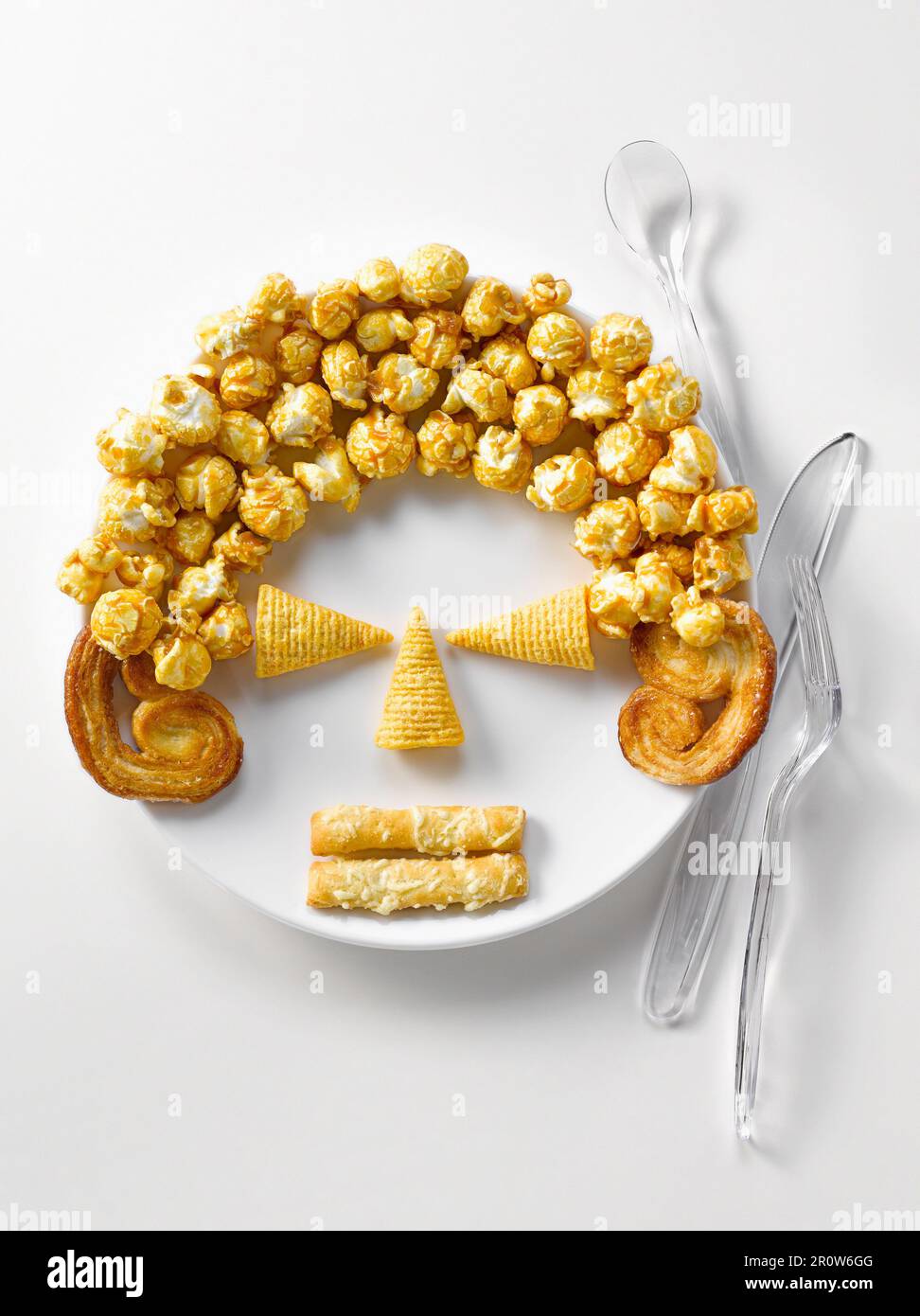 Plate of appetizers and popcorn in the shape of a face Stock Photo - Alamy