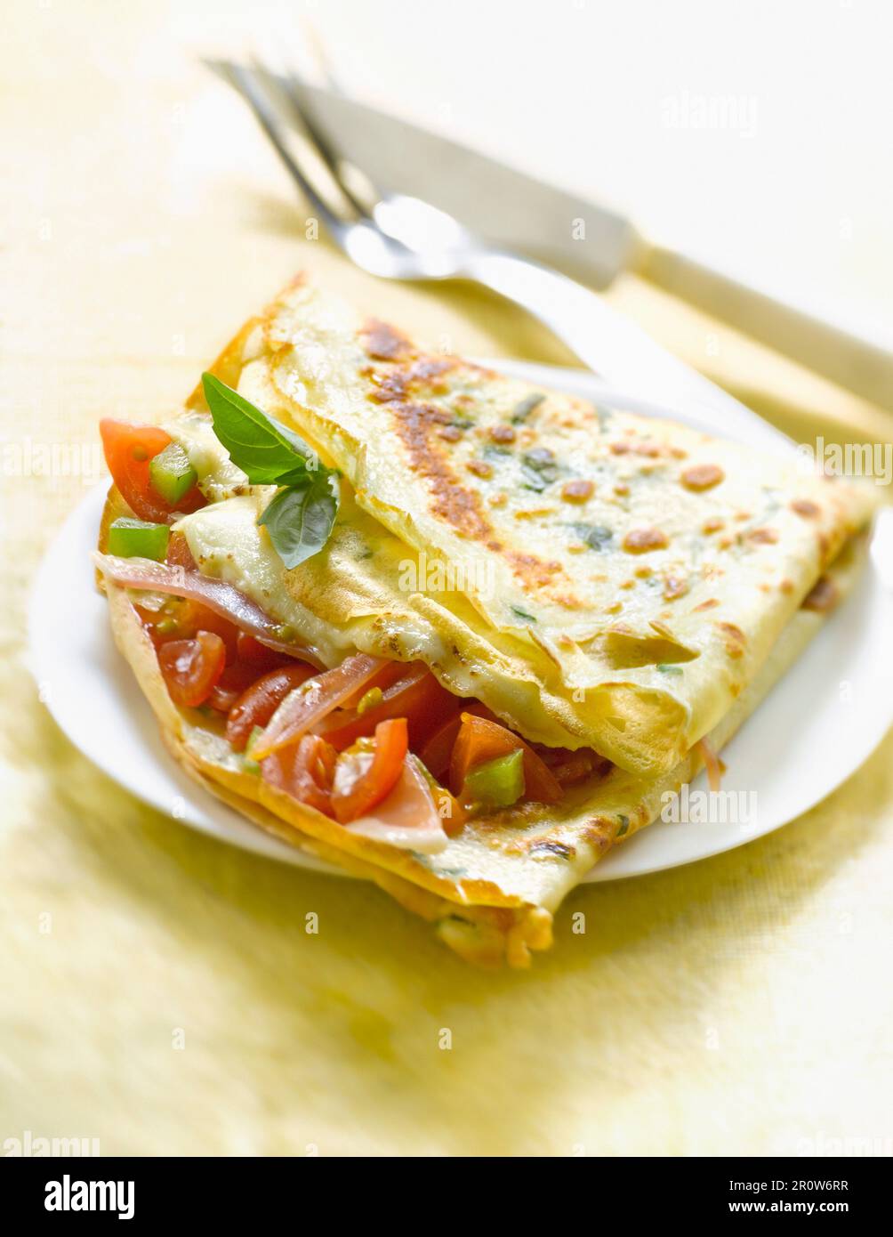 Tomato,pepper,mozzarella and raw ham pancake Stock Photo - Alamy