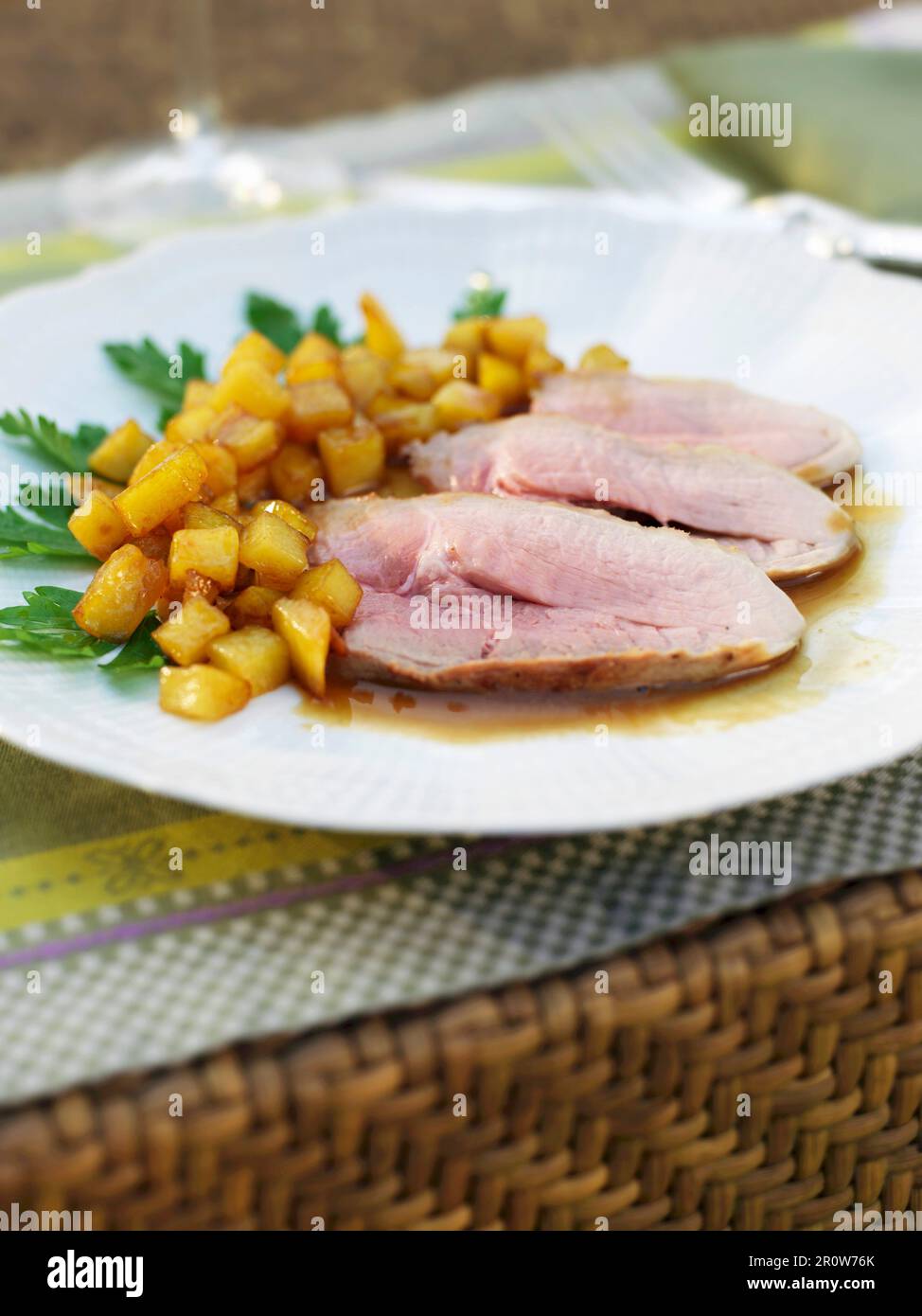 Sliced leg of lamb with sauteed potatoes Stock Photo - Alamy