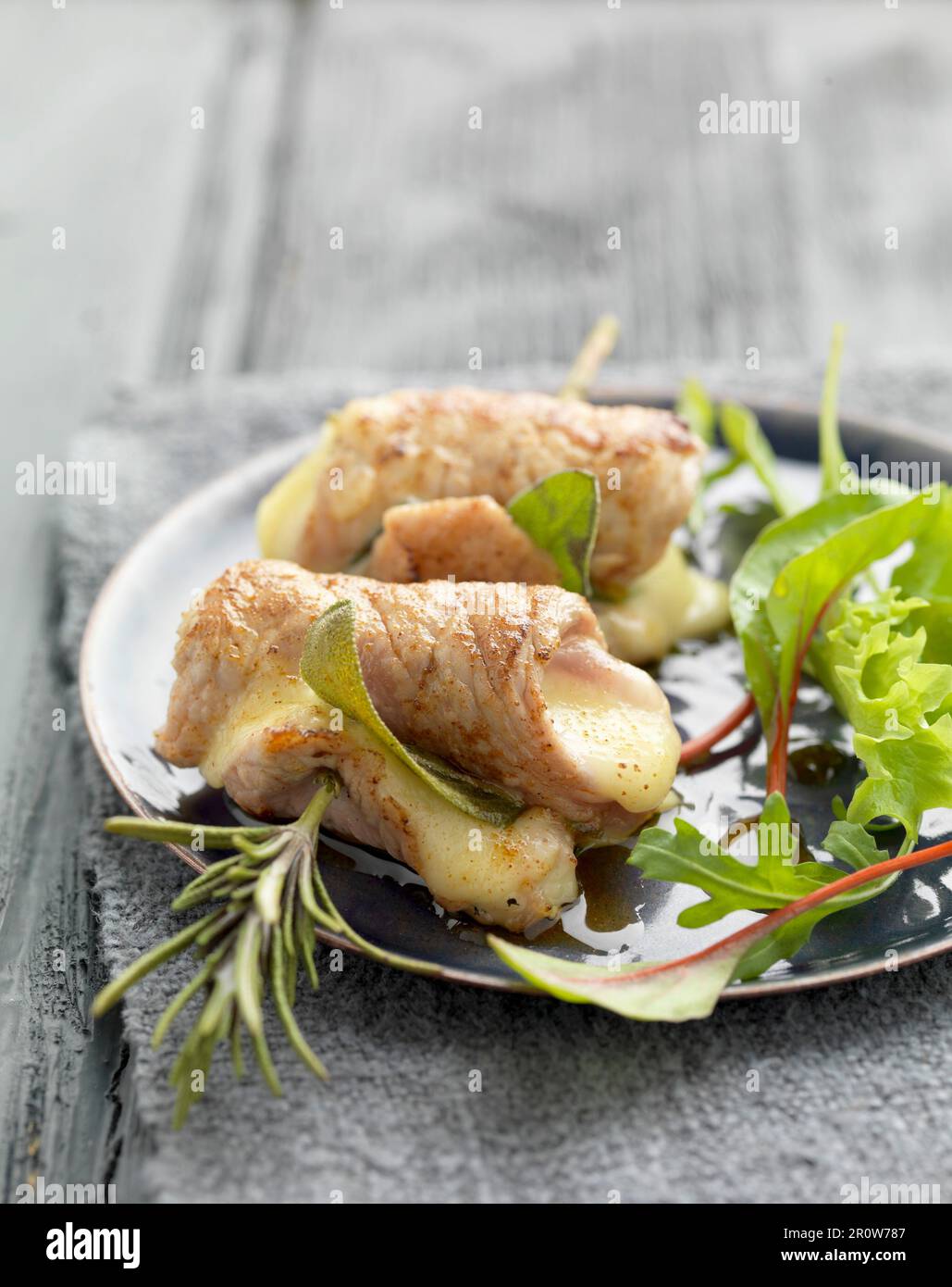 Veal and melted cheese brochette Stock Photo - Alamy