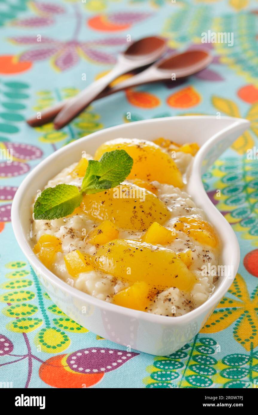 Rice pudding with peaches Stock Photo - Alamy