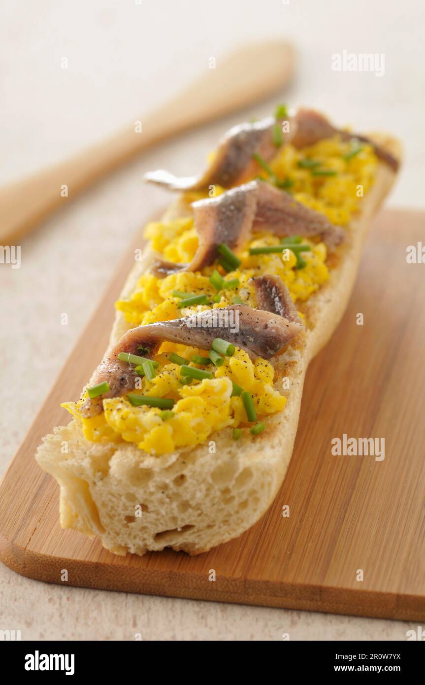 Scrambled egg and anchovy open sandwich Stock Photo - Alamy