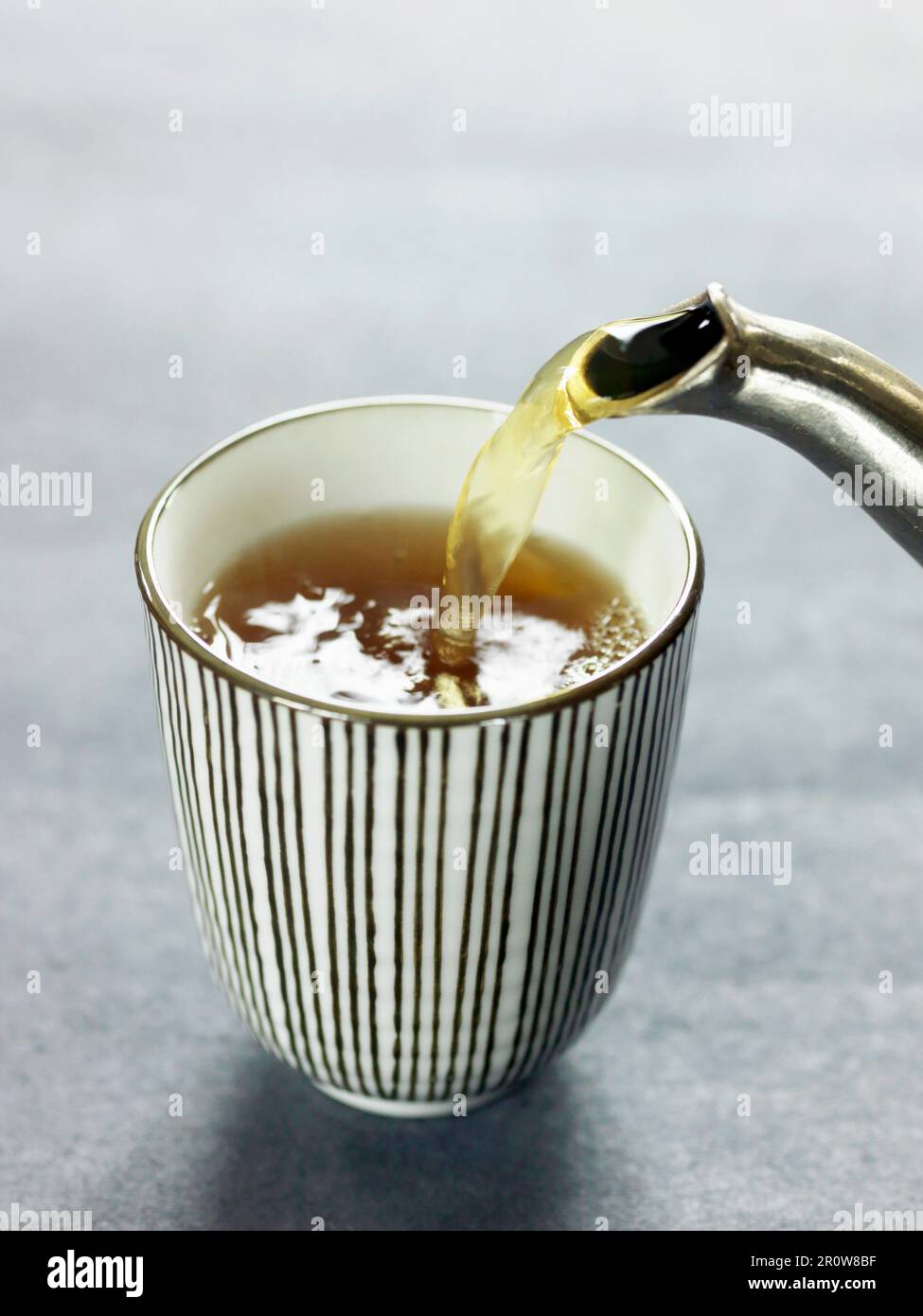 Teapot pouring out tea hi-res stock photography and images - Alamy