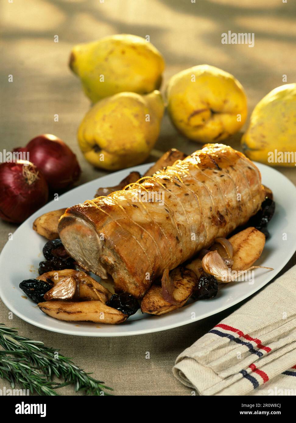 Roast pork with quince and prunes Stock Photo - Alamy