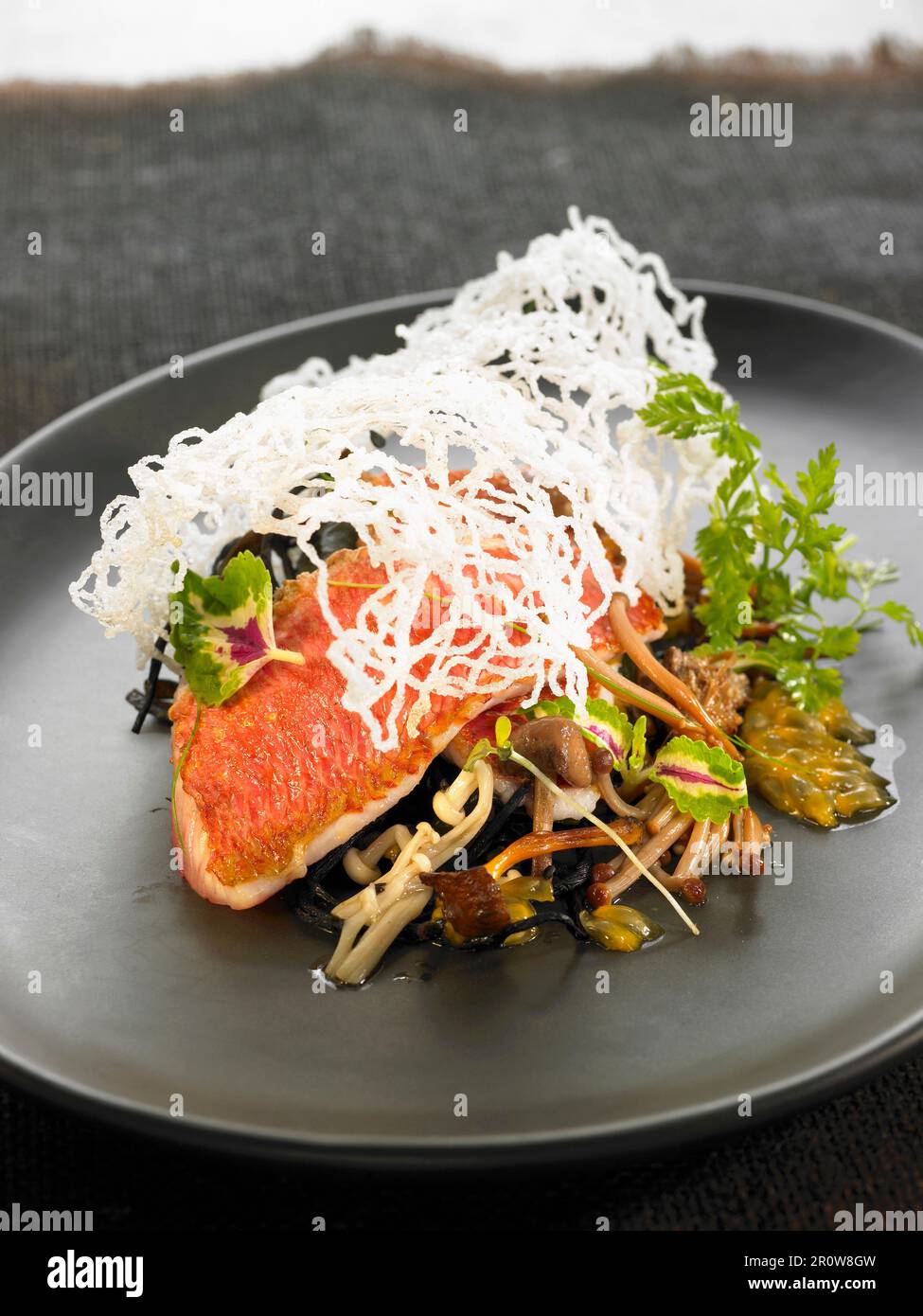 Red mullet fillets with noodles, mushrooms, passion fruit and seaweed ...