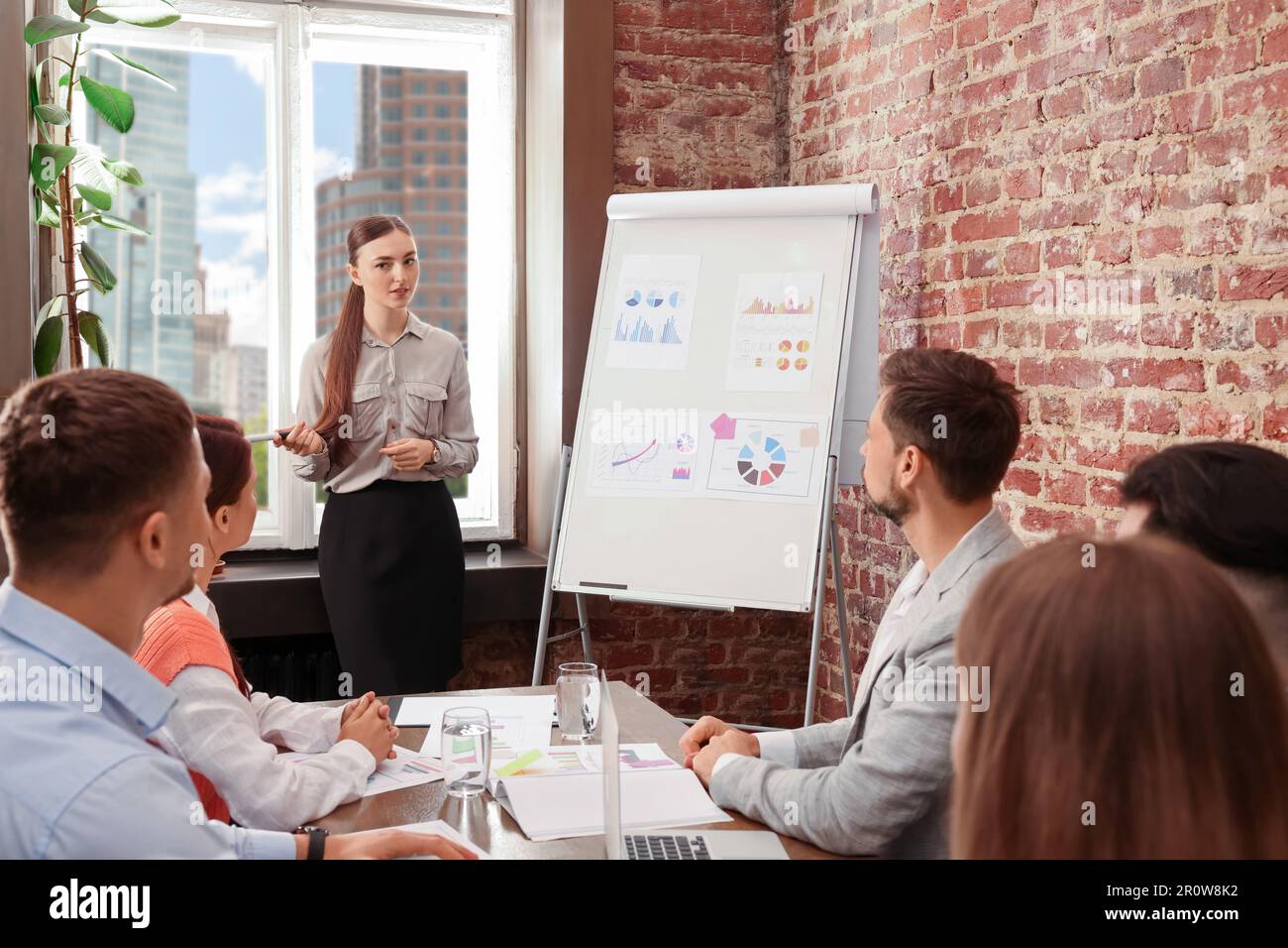 Employees having meeting in office. Team work Stock Photo - Alamy