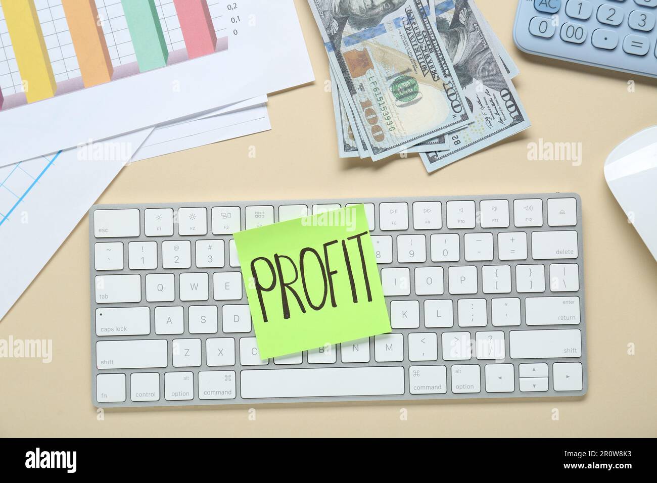 Sticky note with word Profit, keyboard, banknotes and diagram on beige ...