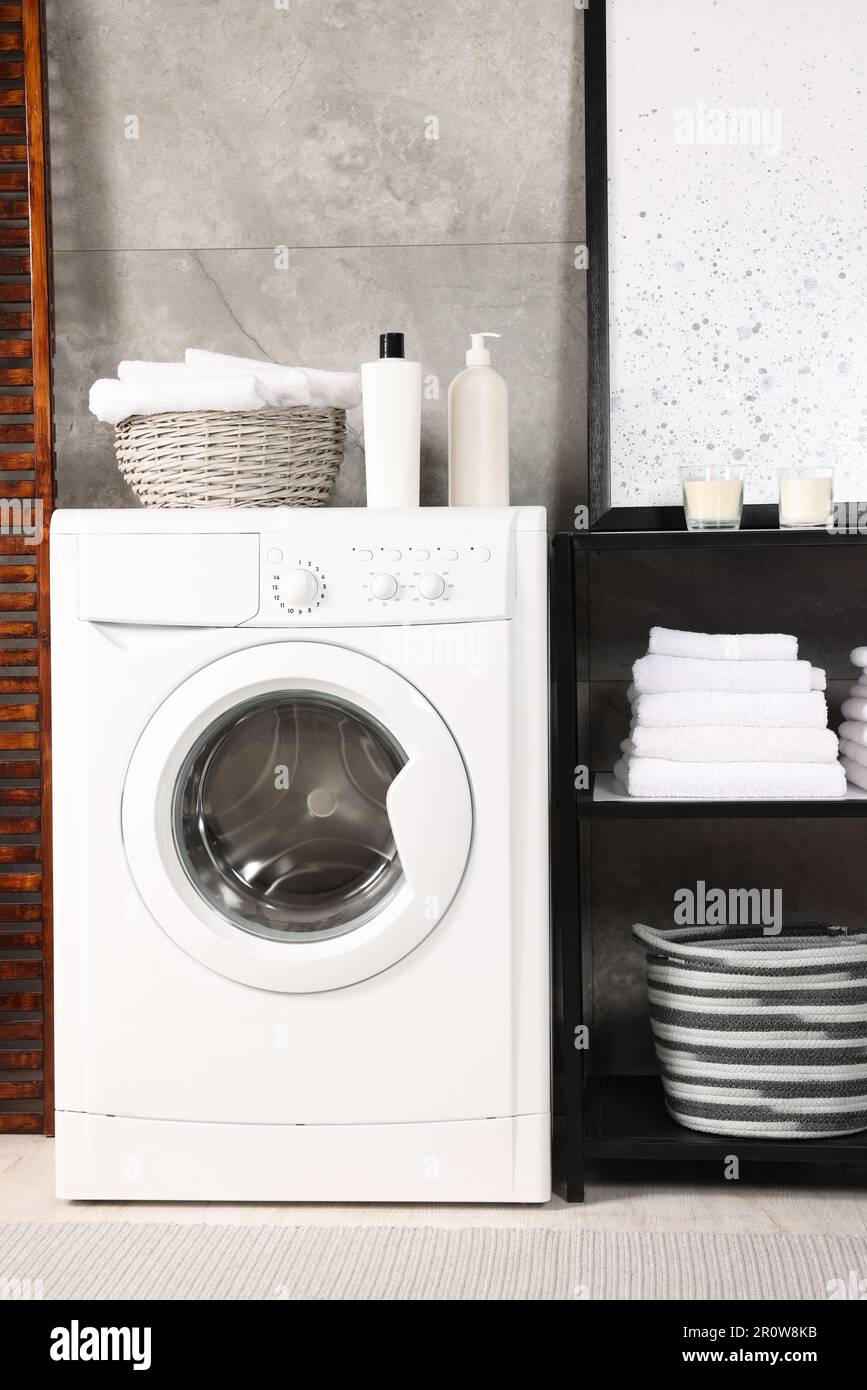 Stylish laundry room with modern washing machine. Interior design Stock ...