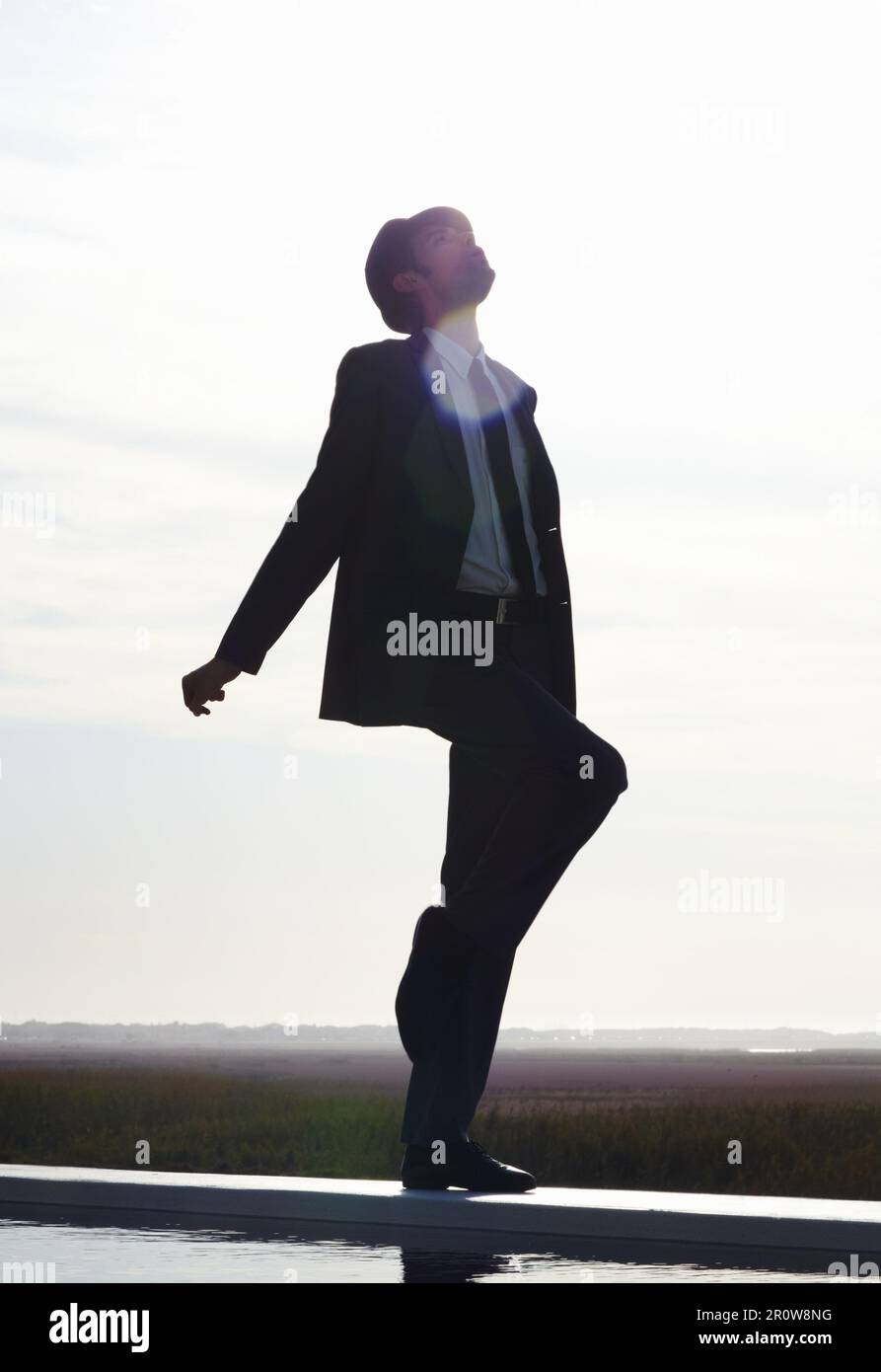 Dance, sky and freedom of man in suit and silhouette whistle with ...