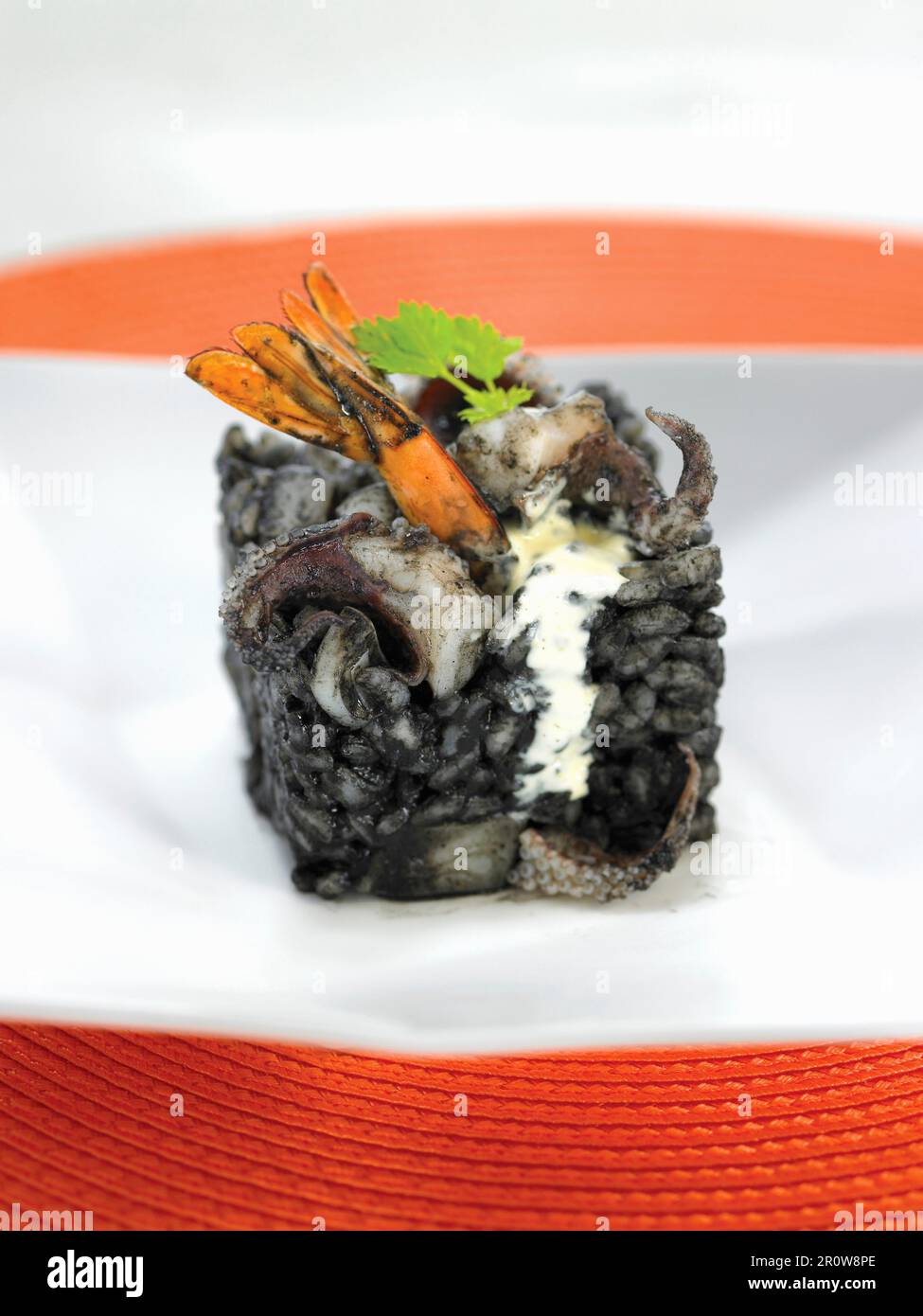 Rice with squid ink and gambas Stock Photo - Alamy
