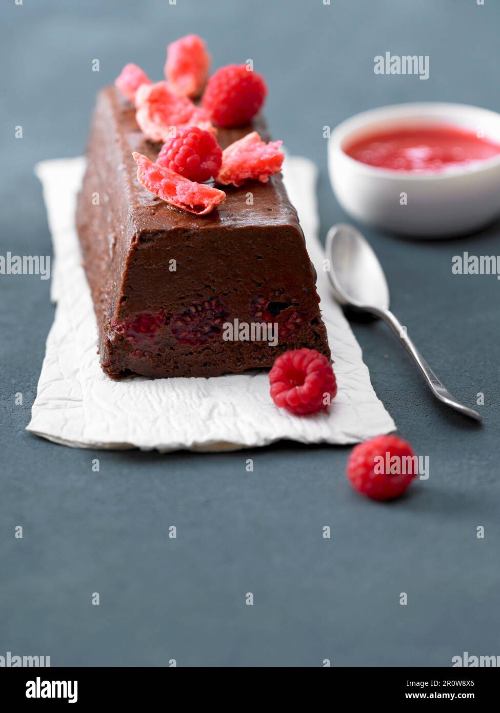 Chocolate terrine with raspberries and macaroons Stock Photo - Alamy