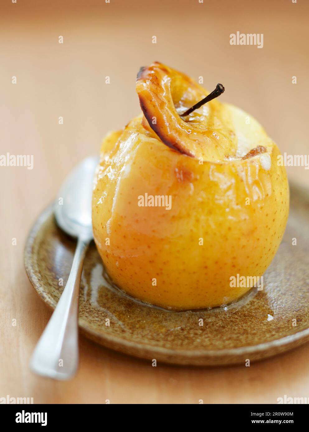 Baked apple with low-fat butter Stock Photo - Alamy