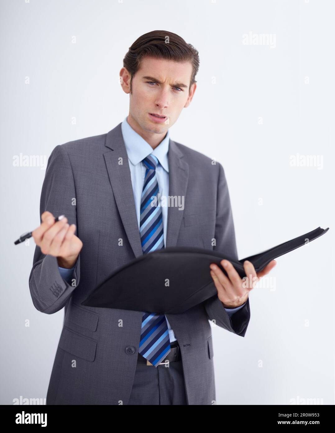 Angry young businessman writing documents hi-res stock photography and ...
