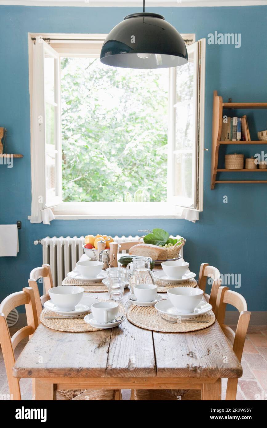 Lunch table in the kitchen Stock Photo - Alamy