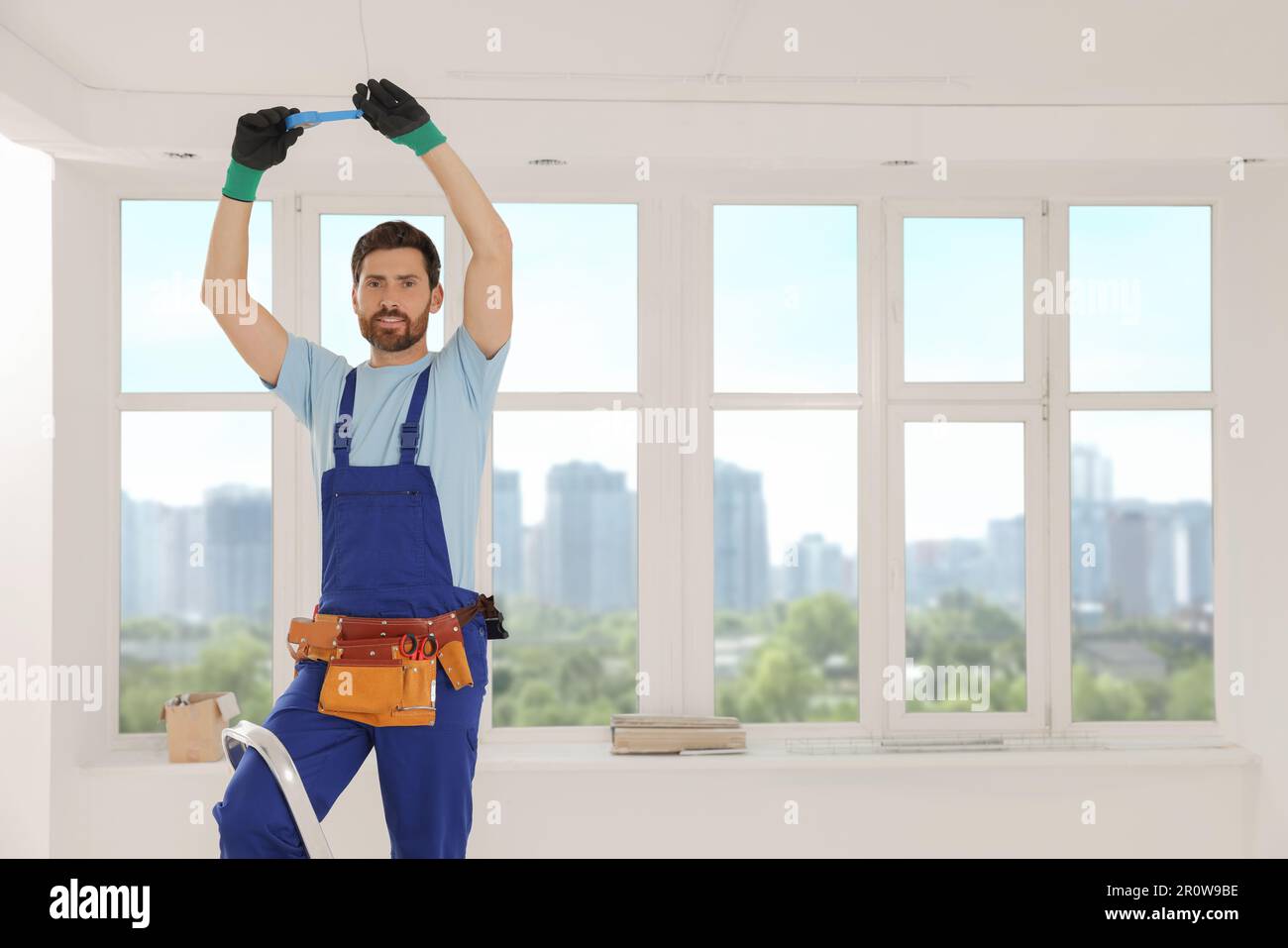 Electrician fixing wires with insulating tape indoors Stock Photo - Alamy