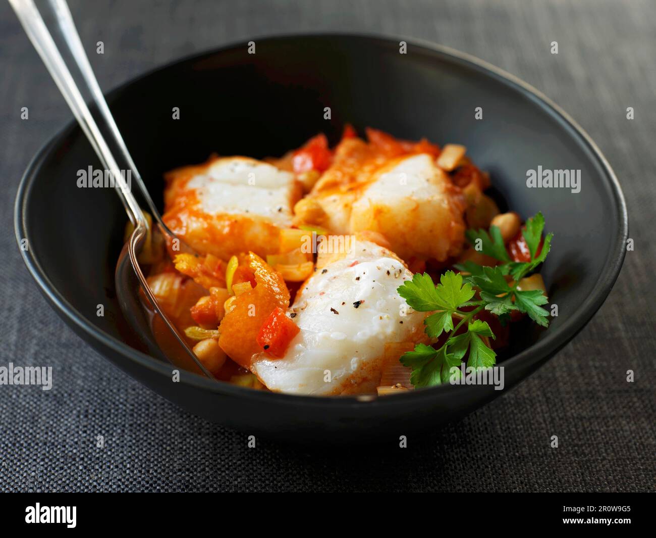 Salt-cod with orange and tomato sauce Stock Photo - Alamy