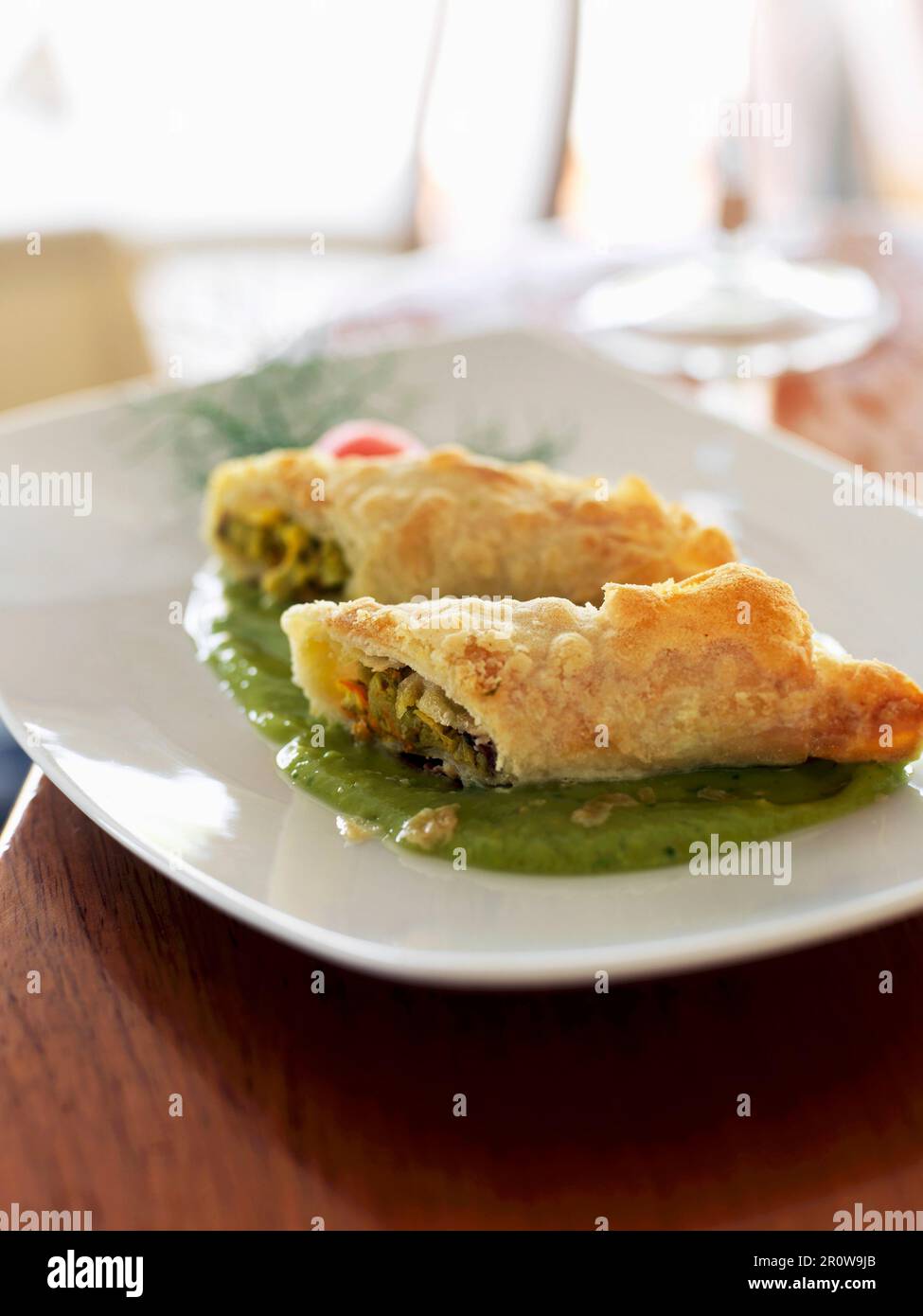 Ricotta and zucchini flower filo pastry rolls Stock Photo - Alamy