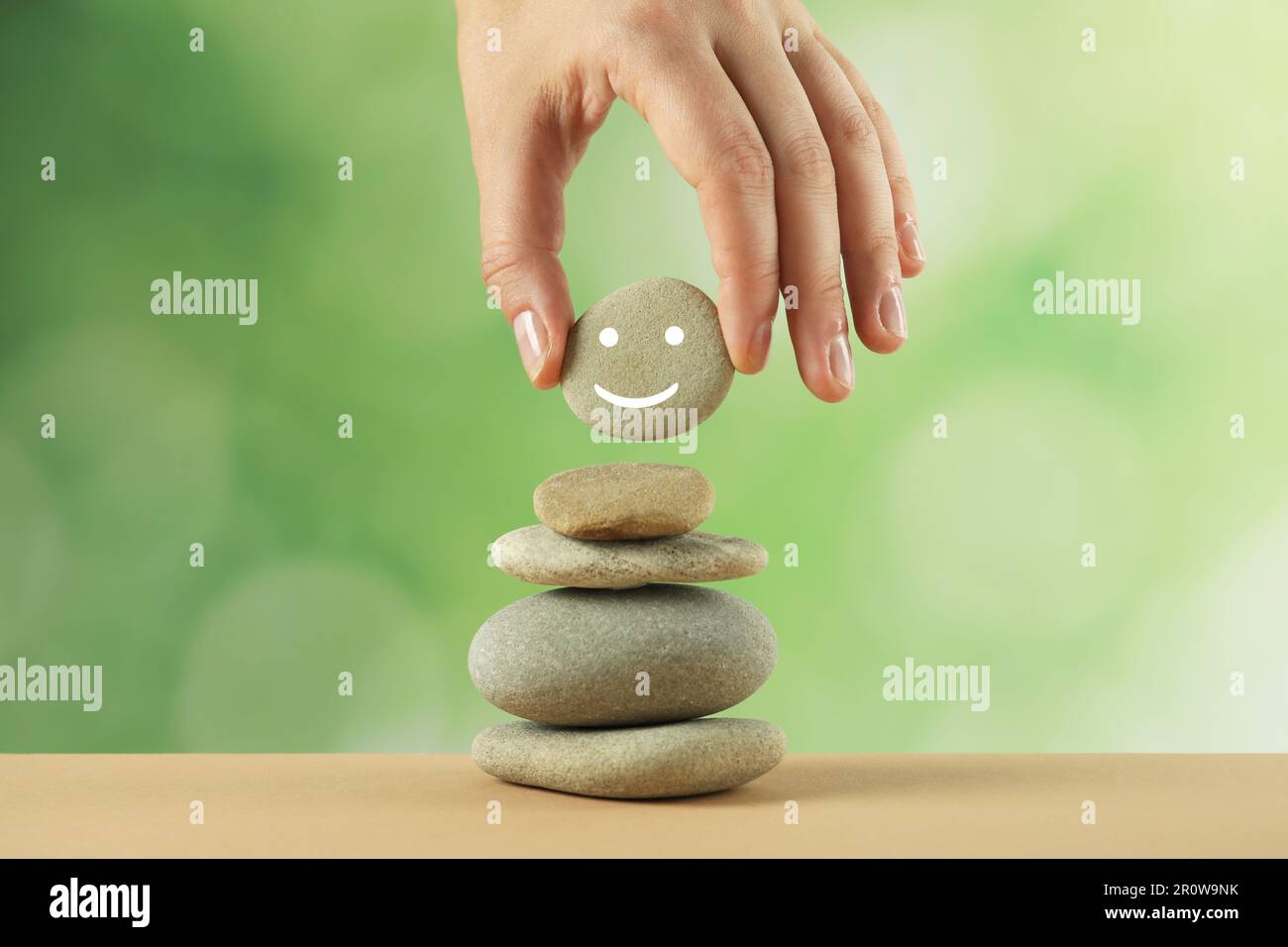 Hand stacking stones hi-res stock photography and images - Alamy