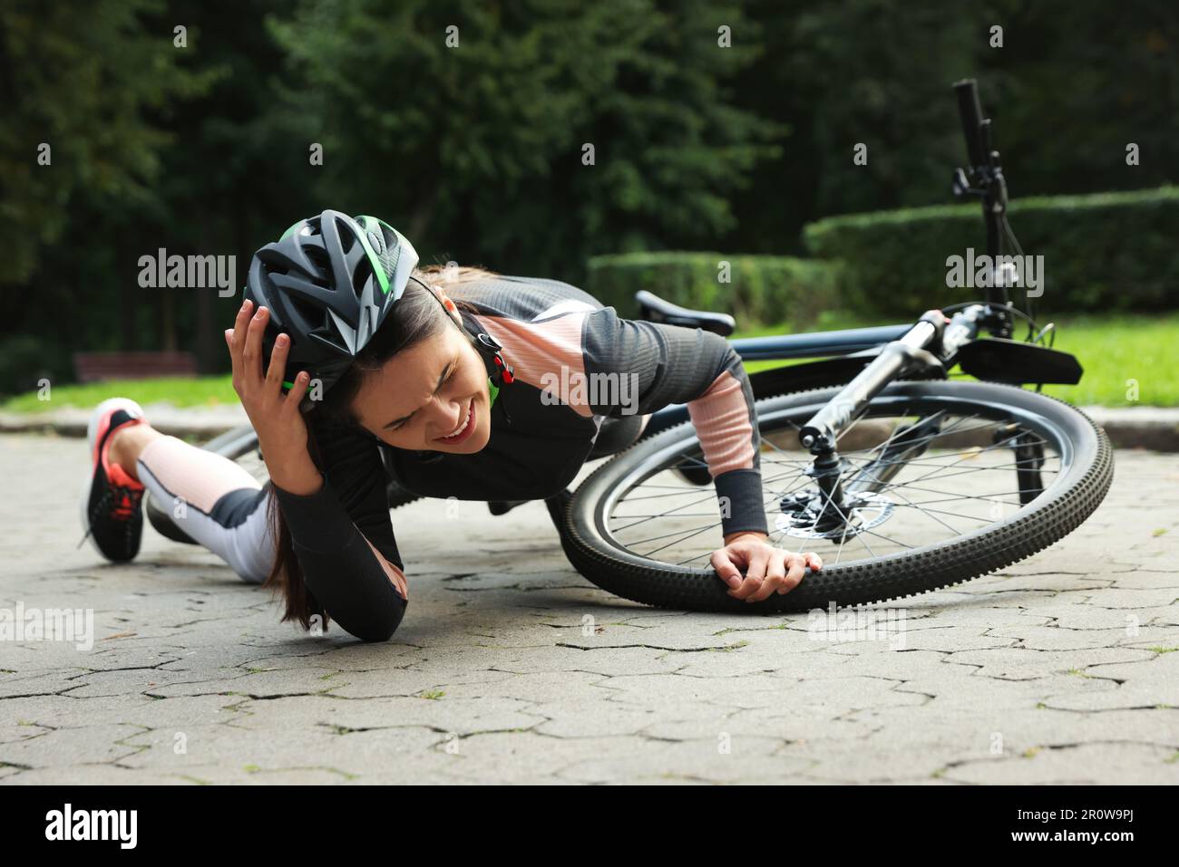 Woman fallen off her bicycle hi-res stock photography and images - Alamy