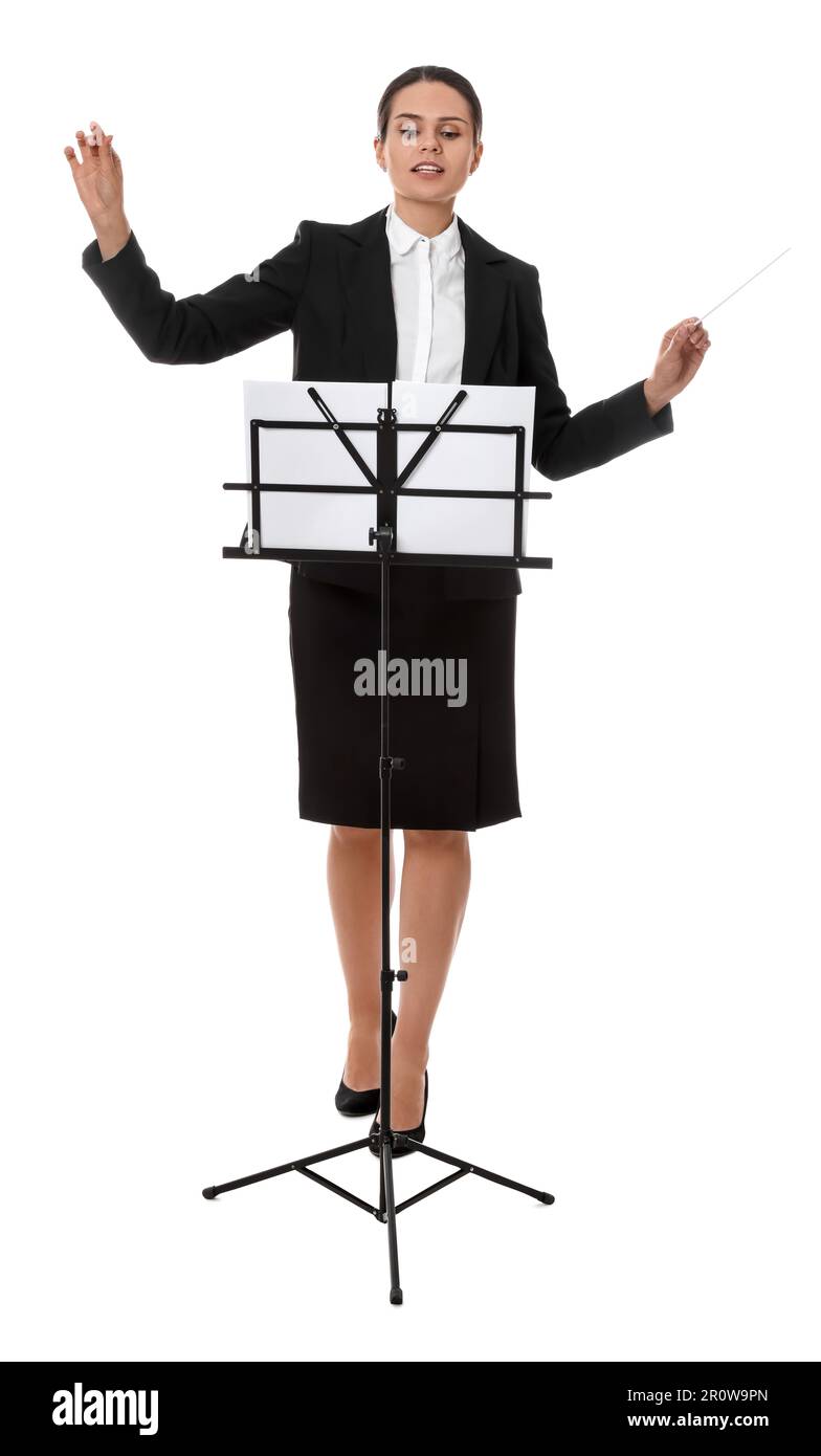 Professional conductor with baton and note stand on white background ...