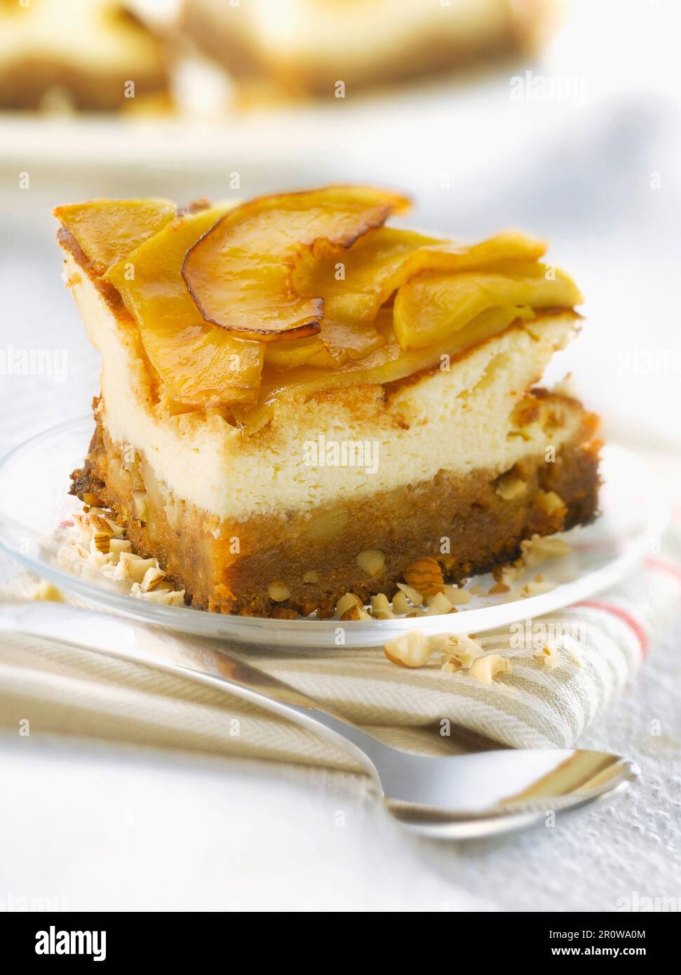 Apple flambé and hazelnut cheesecake Stock Photo - Alamy