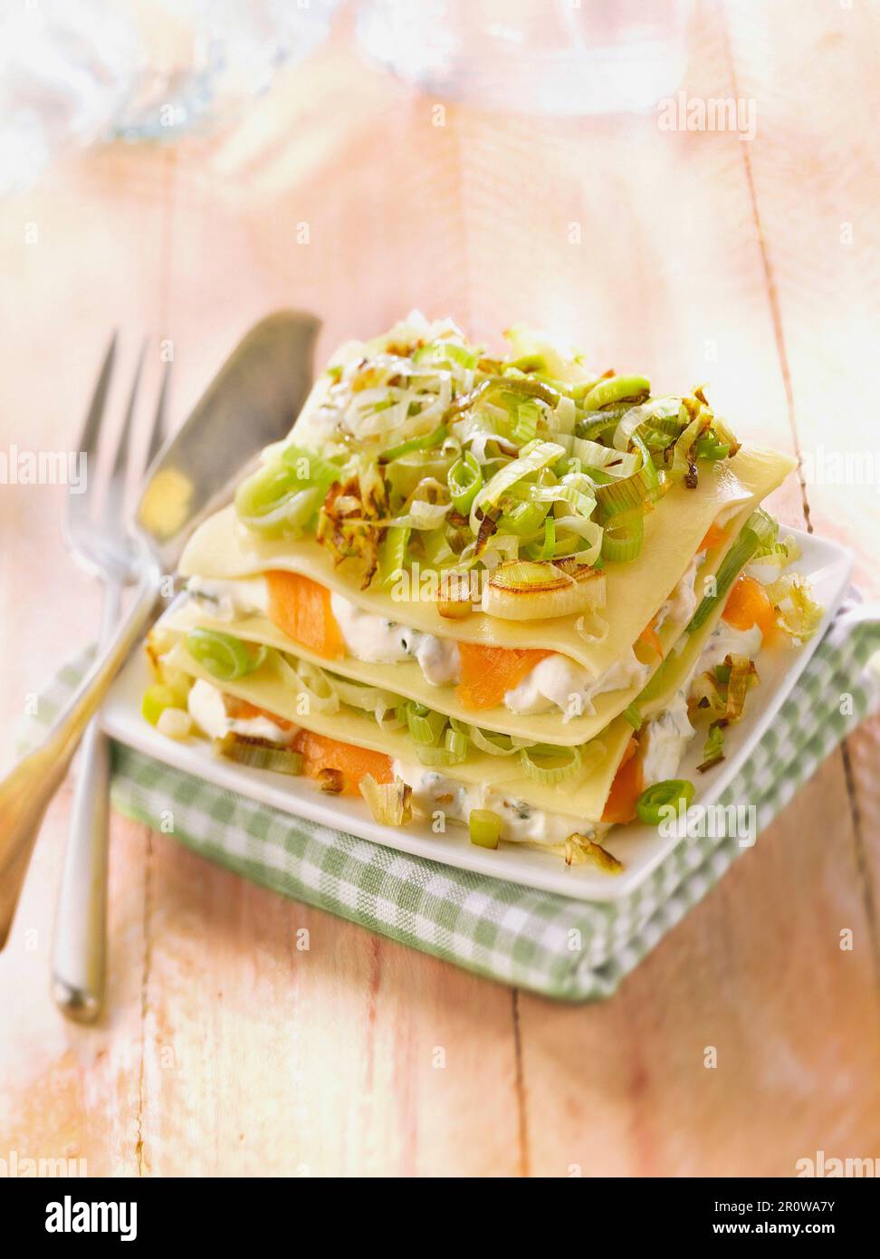 Leek and smoked trout cheese-topped dish Stock Photo - Alamy