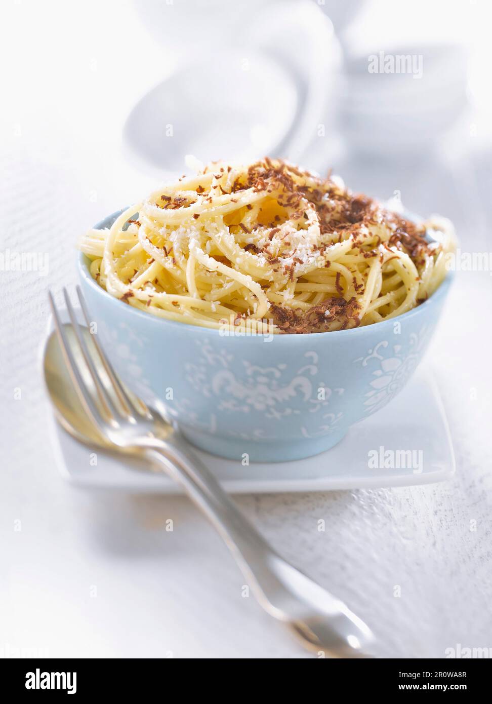 Spaghetti with chocolate flakes and powdered coconut Stock Photo - Alamy