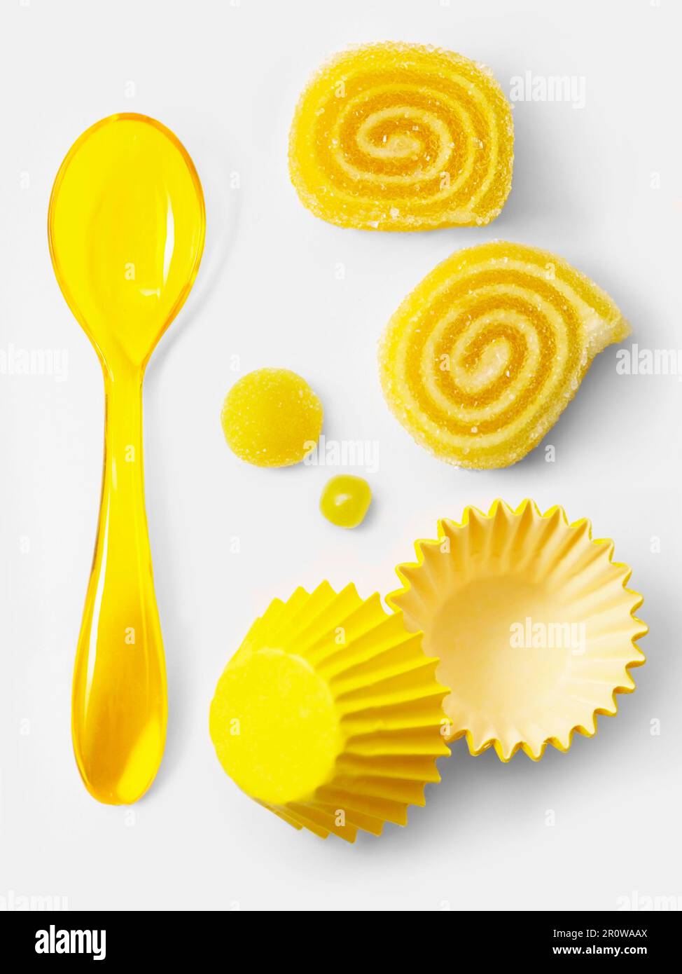 Yellow rolled candies and paper cups Stock Photo - Alamy