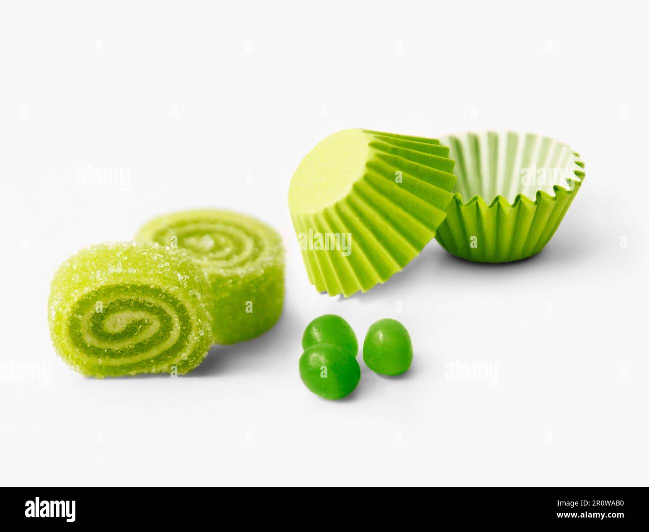 Green rolled candies and paper cups Stock Photo - Alamy