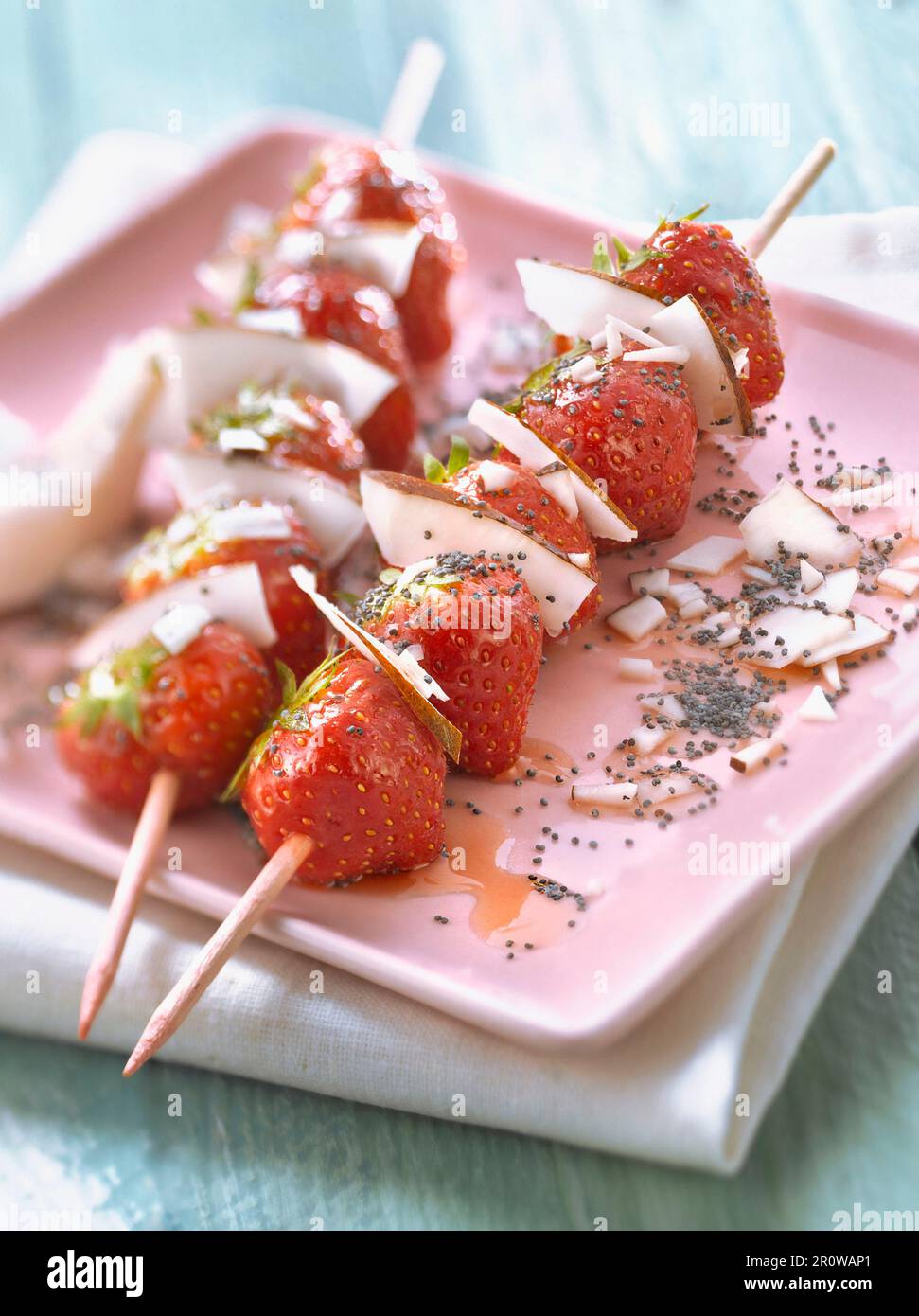 Strawberry and coconut brochettes with red poppy syrup and black poppy ...