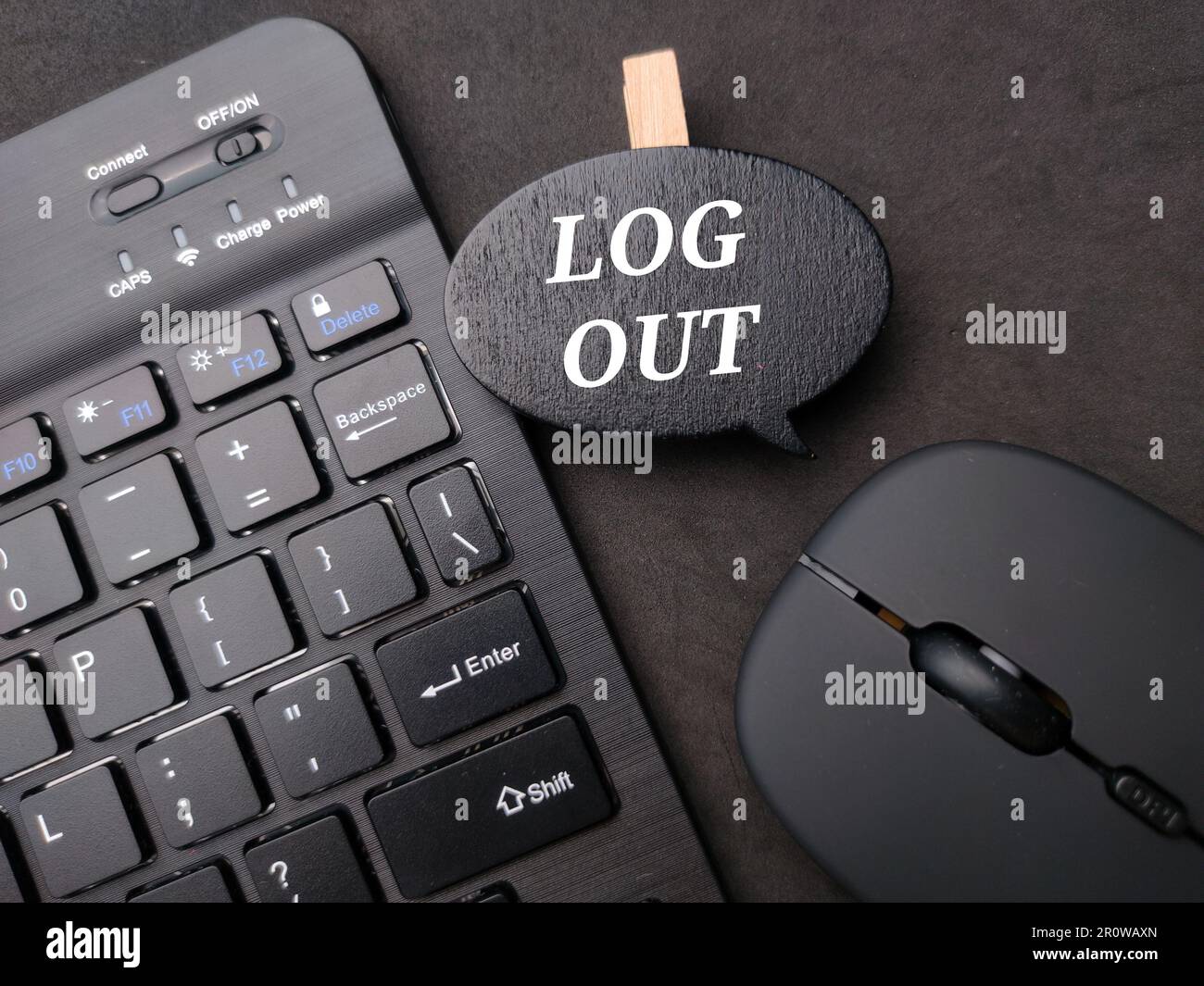 Wireless keyboard and mouse with the word LOG OUT on black background ...
