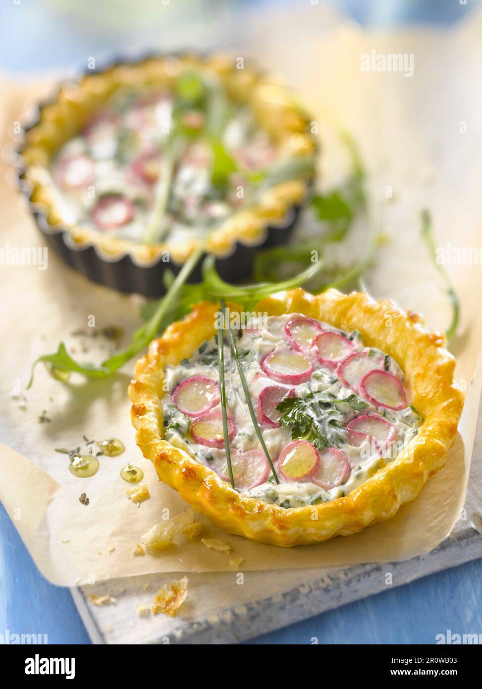 Cream cheese,pink radish and herb tartlets Stock Photo - Alamy
