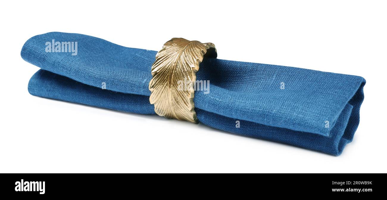 Blue fabric napkin with decorative ring for table setting on white ...
