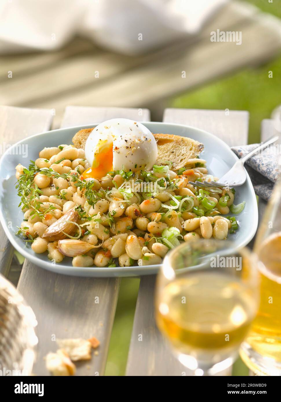 White haricot bean salad with pink garlic and a soft-boiled egg Stock ...