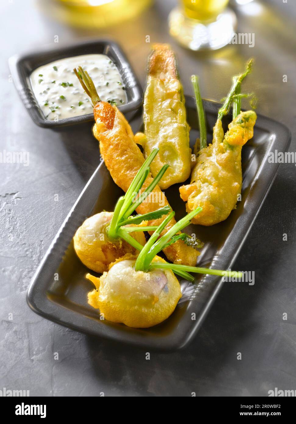 Crisp mini vegetable fritters with yogurt herb sauce Stock Photo - Alamy