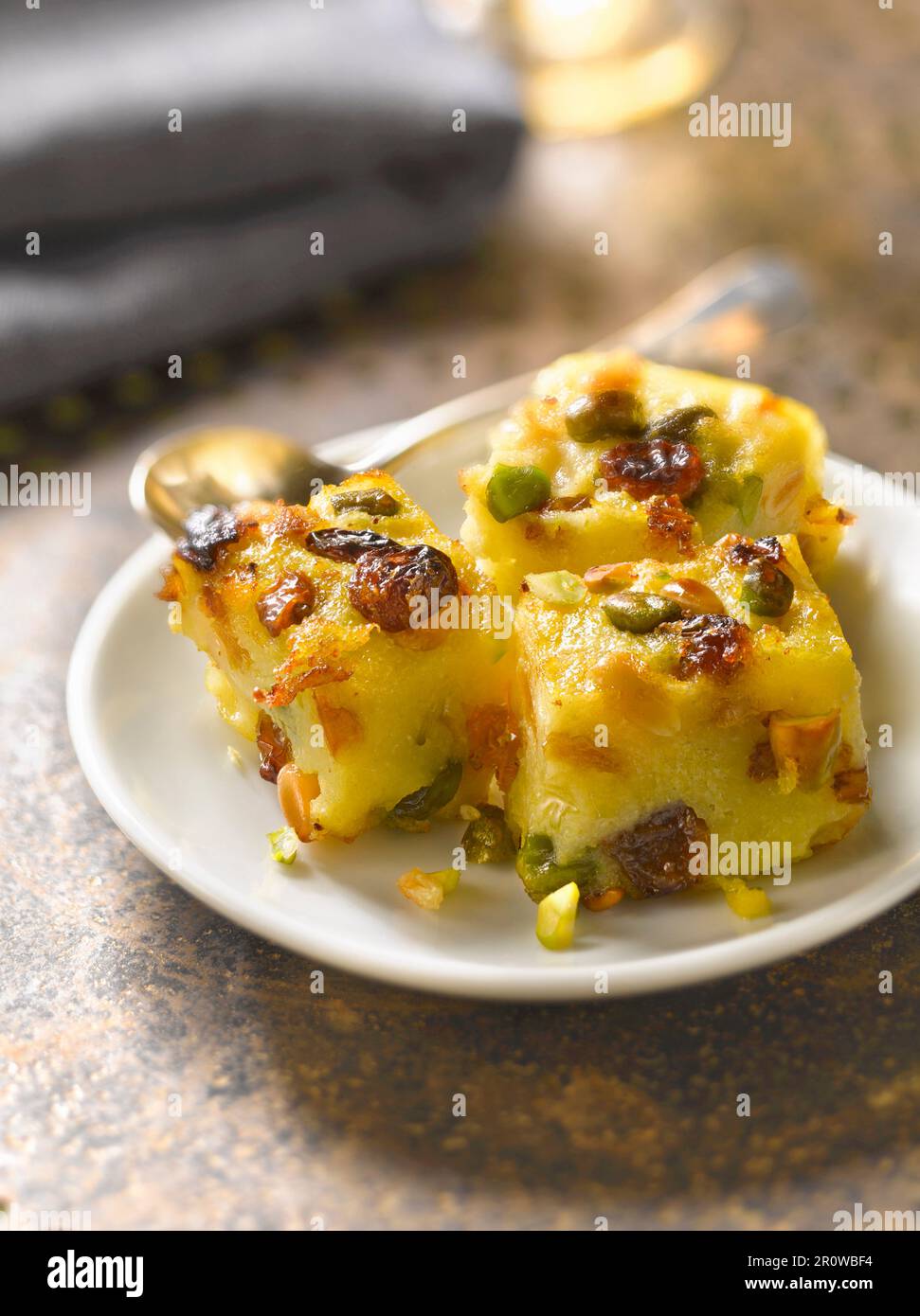 Sweet polenta, raisin, pine nut and pistachio pudding Stock Photo - Alamy