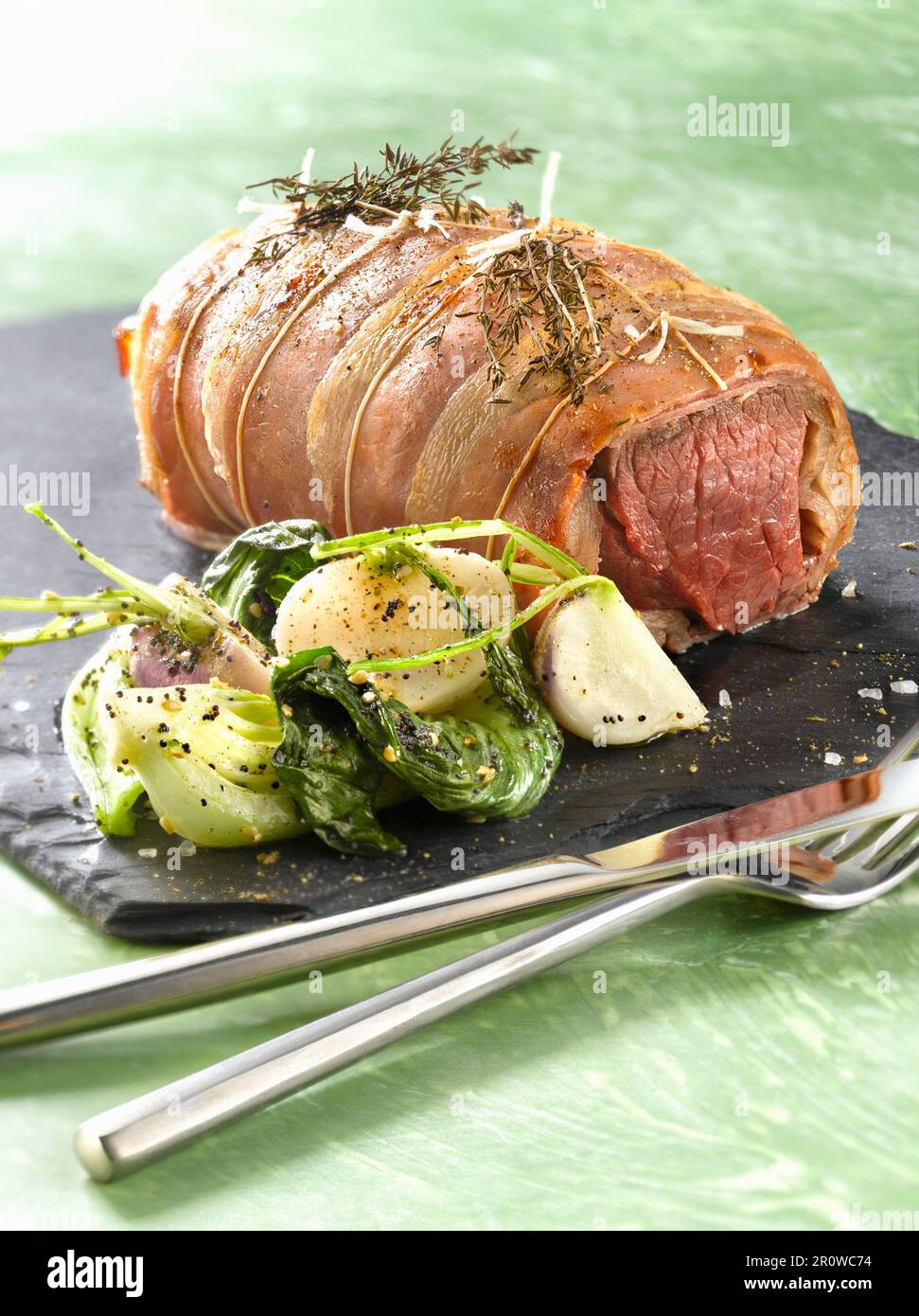 Beef fillet wrapped in lard,pak-choi cabbage with spring turnips Stock ...