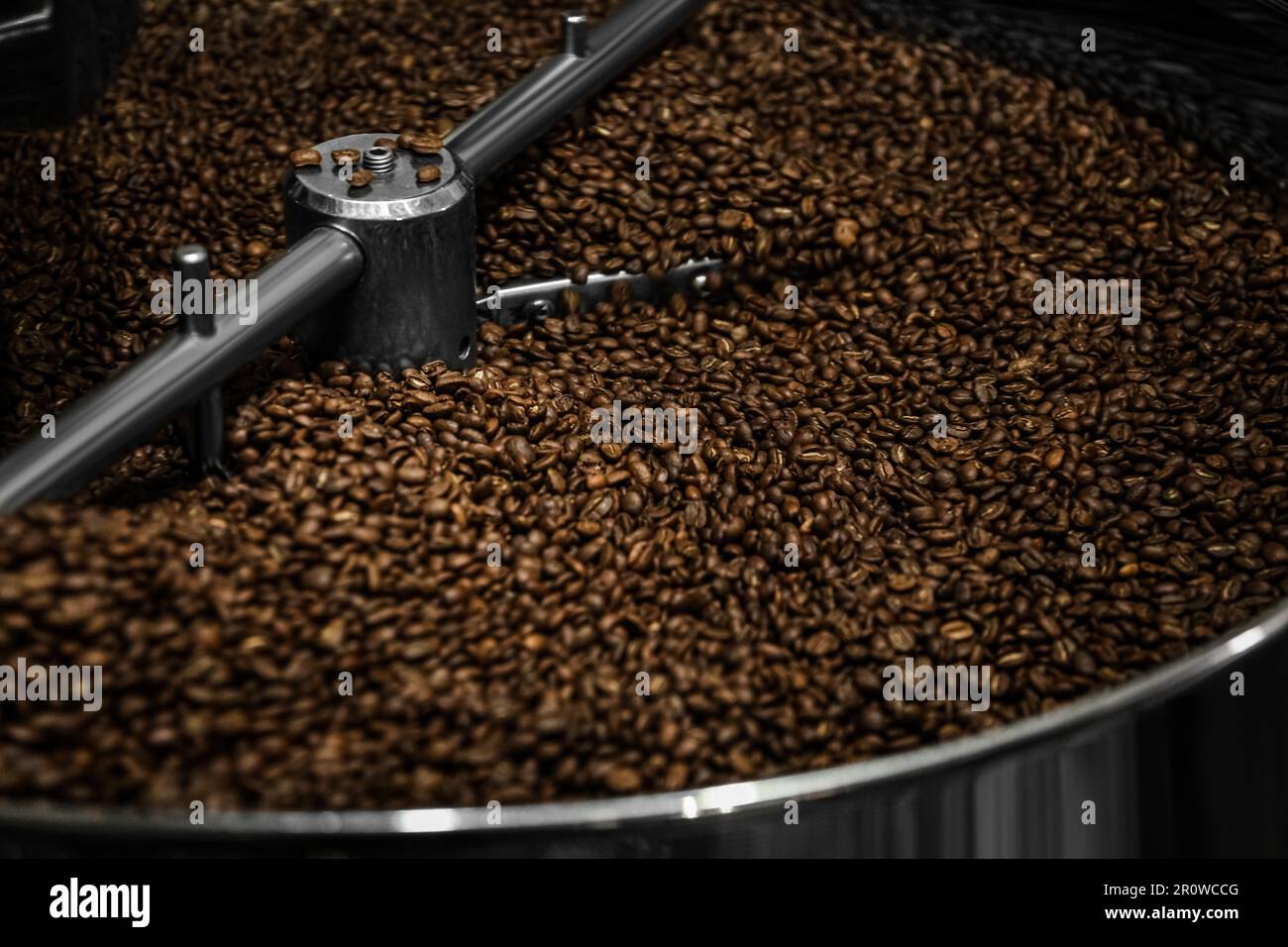 Modern coffee roaster machine with beans, closeup Stock Photo - Alamy