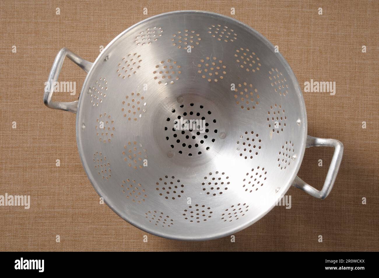 Empty metal colander Stock Photo - Alamy
