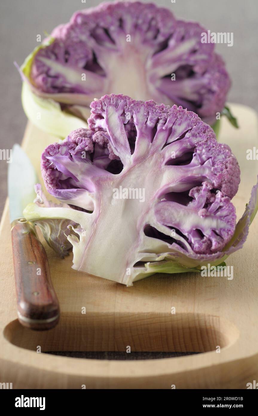 Cutting a purple cauliflower Stock Photo - Alamy