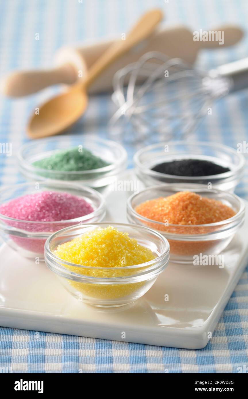 Bowls of different colored sugars Stock Photo - Alamy