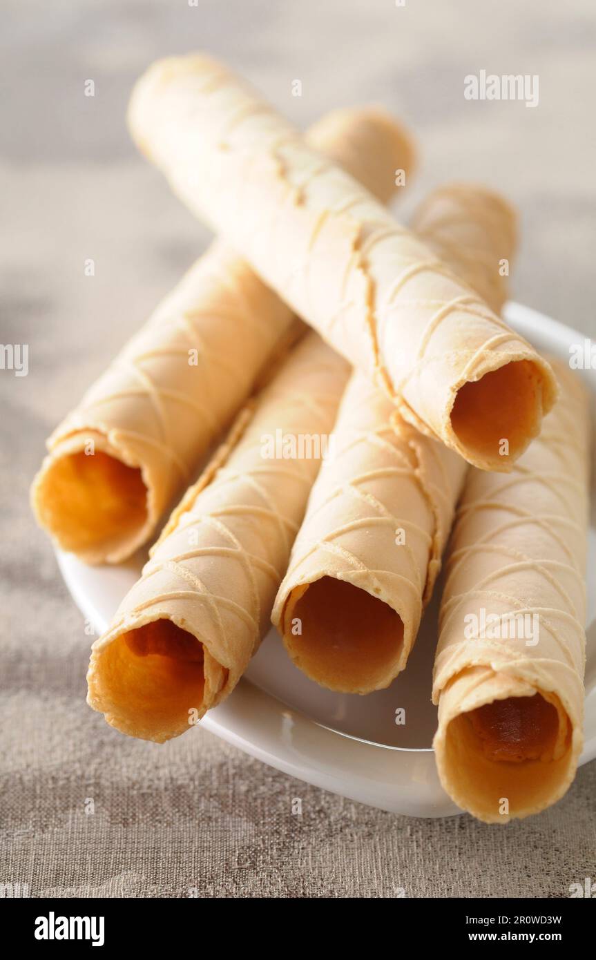 Waffle-style rolled cigarette russe biscuits Stock Photo - Alamy