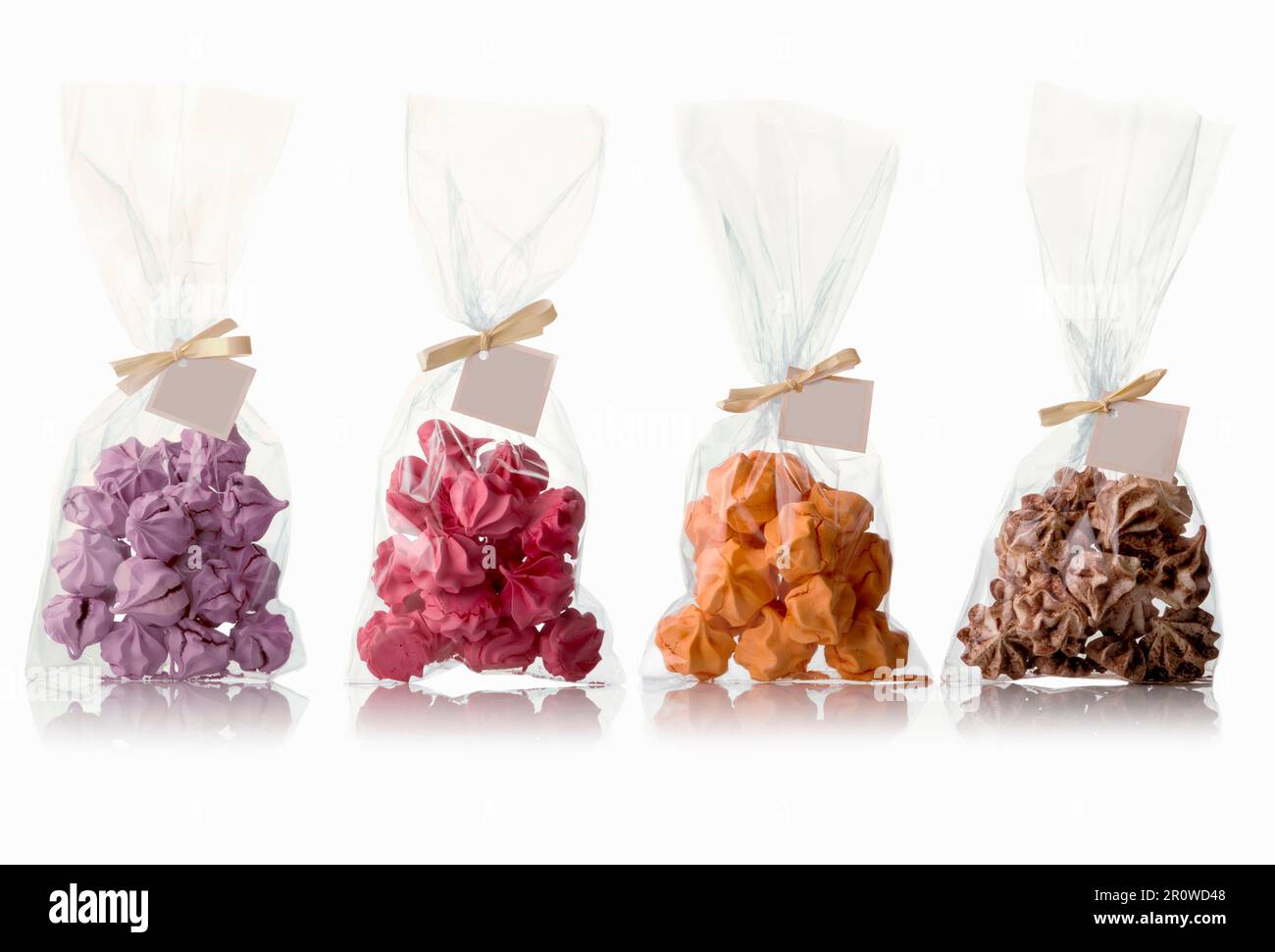Four bags of different flavored meringues Stock Photo - Alamy