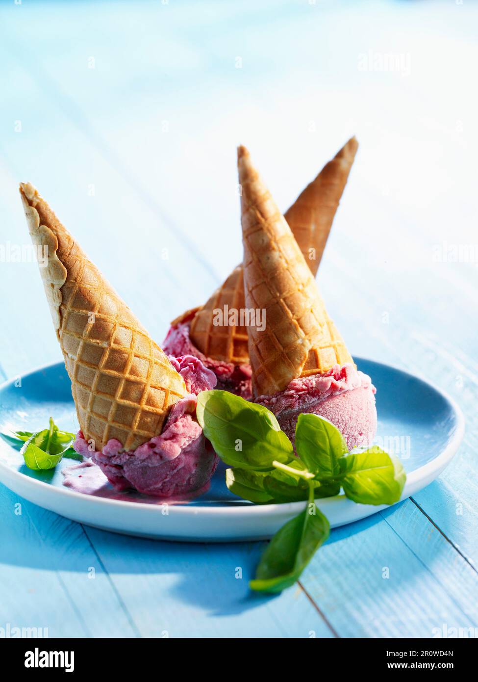 Raspberry sorbet cones Stock Photo - Alamy