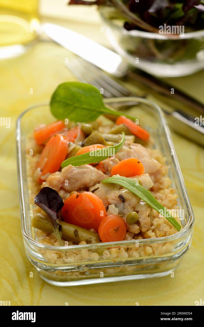 Chicken with bulghour and tarragon Stock Photo - Alamy