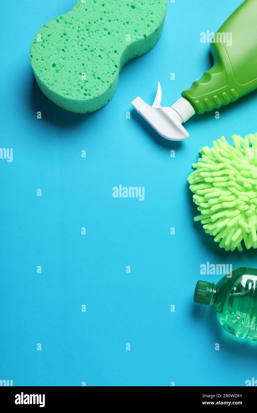 Different car wash products on light blue background, flat lay. Space ...