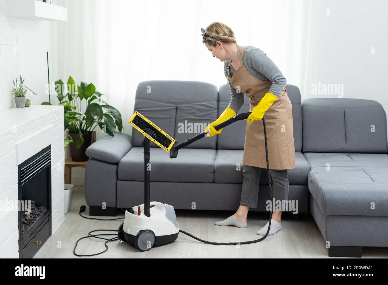 Dry cleaners man employee removing hi-res stock photography and images ...
