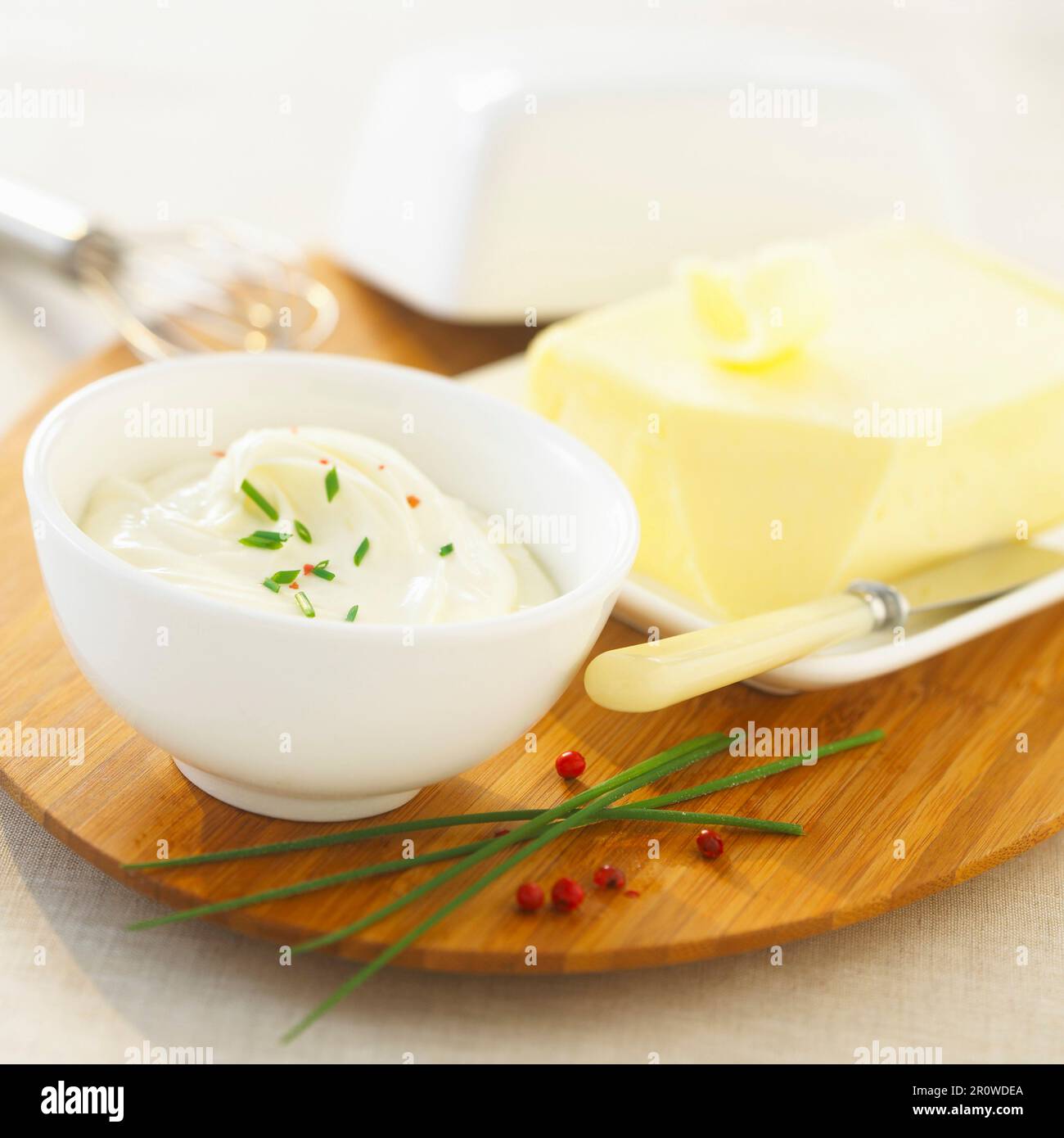 Bowl of thick cream and a slab of butter Stock Photo - Alamy