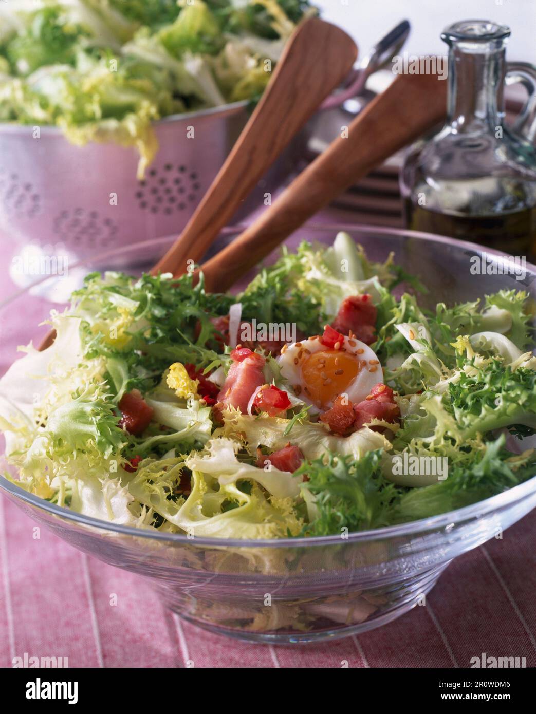 Chicory lettuce with diced bacon and a soft-boiled egg Stock Photo - Alamy